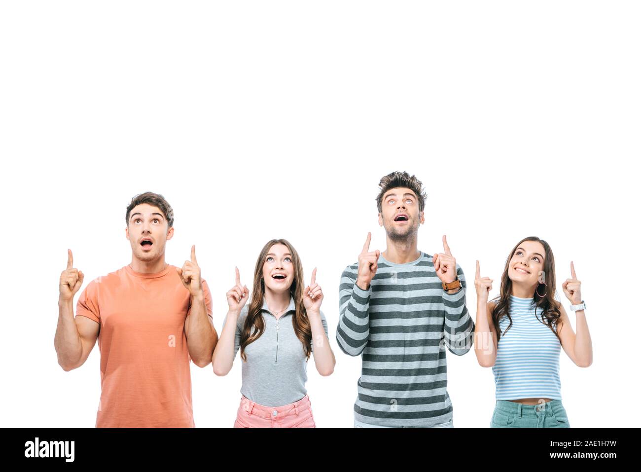 shocked friends pointing up isolated on white Stock Photo - Alamy