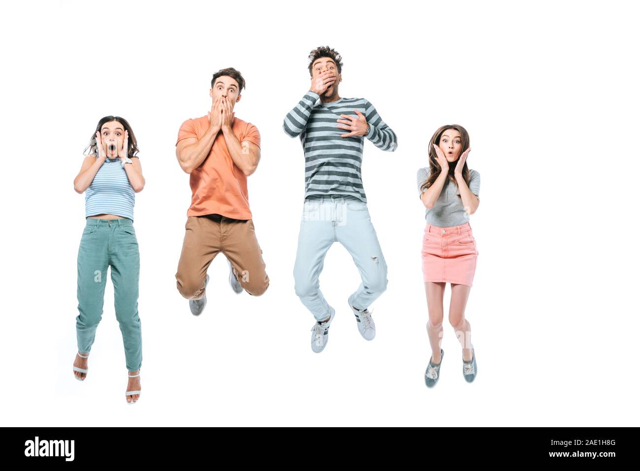 excited friends jumping and celebrating together, isolated on white ...