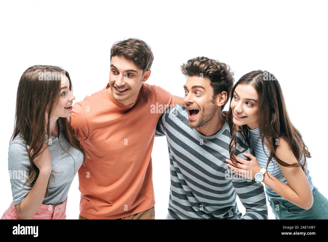 surprised friends screaming and hugging together isolated on white ...