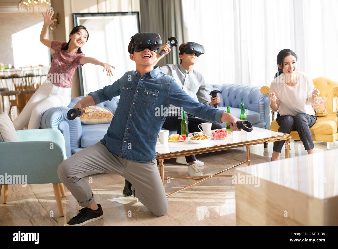 Young friends playing VR game Stock Photo - Alamy