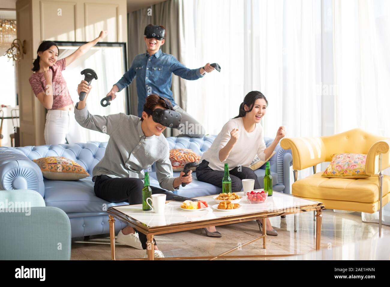 Young friends playing VR game Stock Photo - Alamy