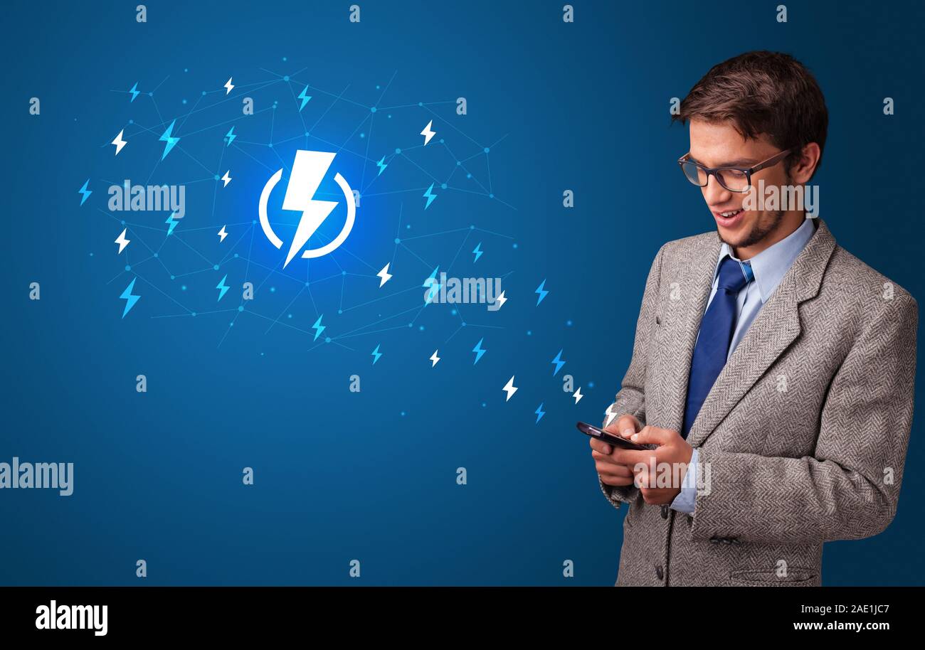 Young person using phone with power concept Stock Photo - Alamy