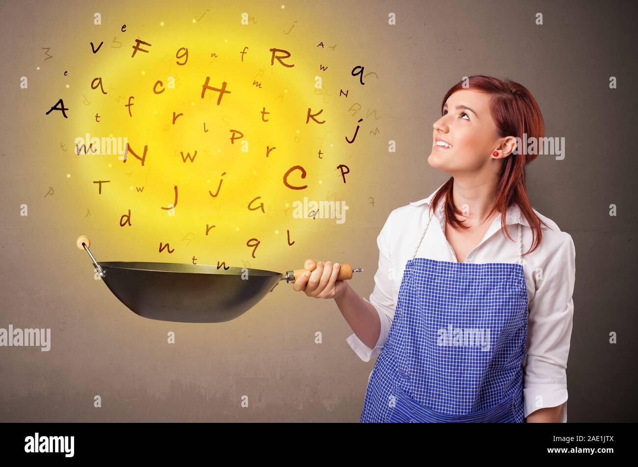 Young person cooking letters in wok Stock Photo - Alamy