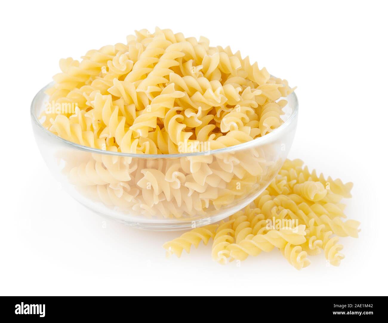 Uncooked fusilli pasta in glass bowl isolated on white background Stock ...