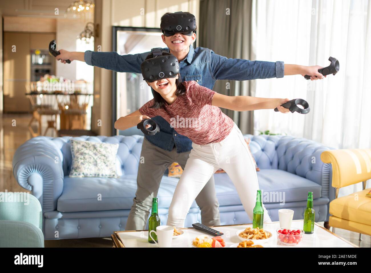 Young couple playing VR game Stock Photo - Alamy