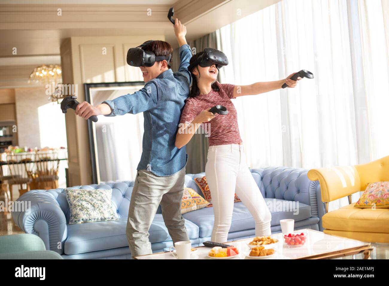 Young couple playing VR game Stock Photo - Alamy