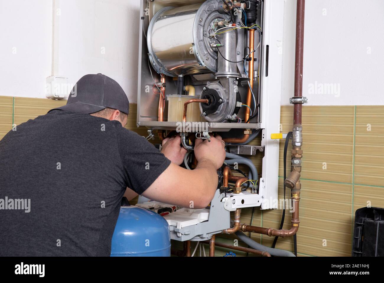 Man heater checking hi-res stock photography and images - Alamy