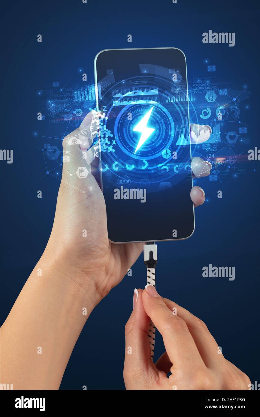 Elegant hand charging smartphone with global report concept Stock Photo ...
