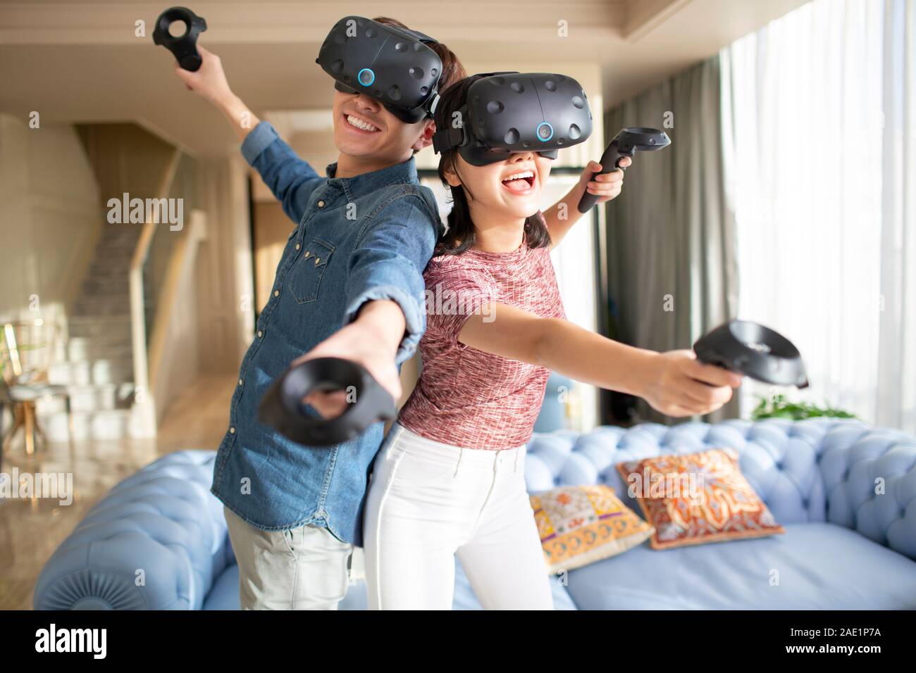 Young couple playing VR game Stock Photo - Alamy