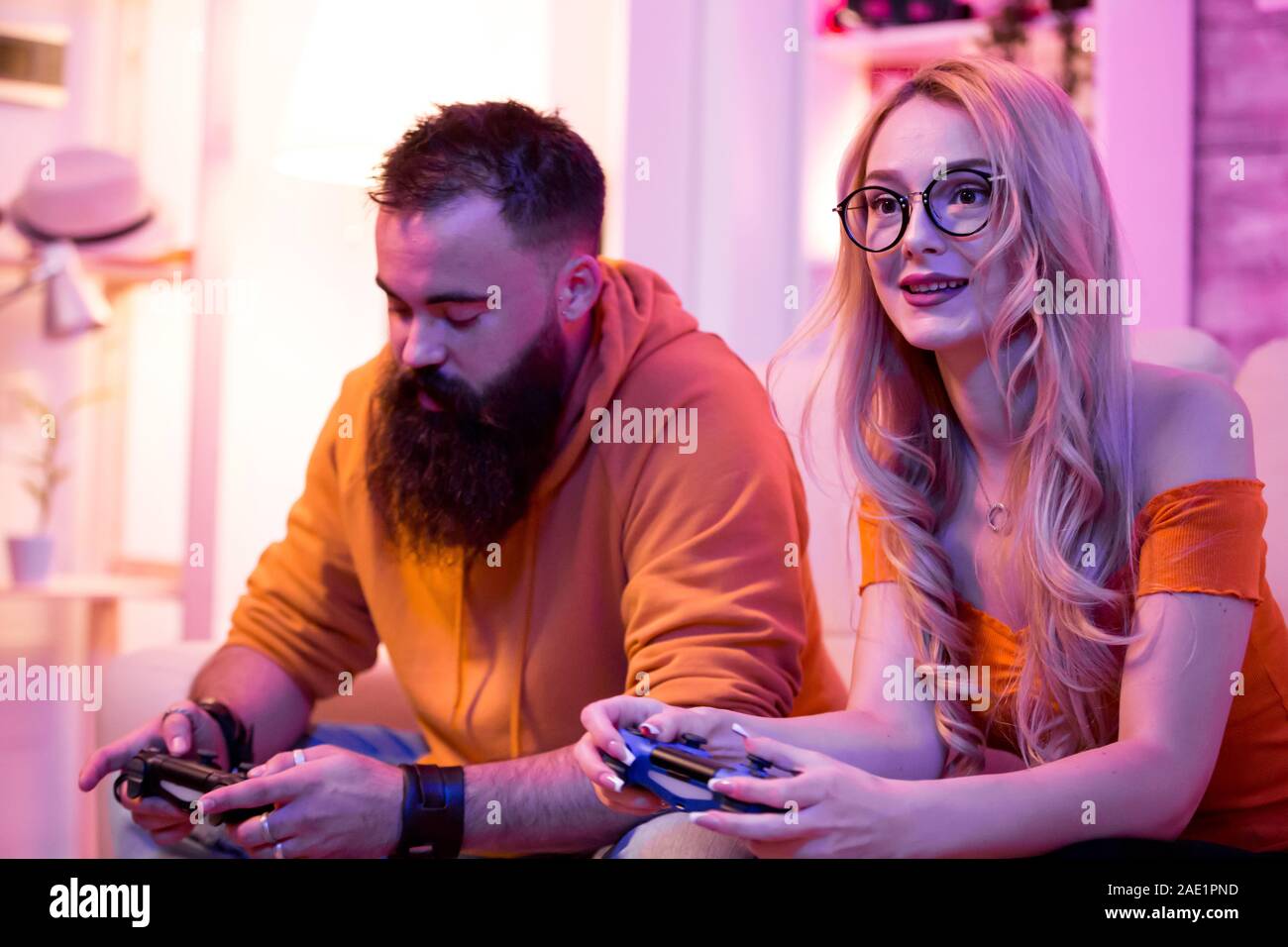 Thoughtful boyfriend while playing online games with hig beautiful ...