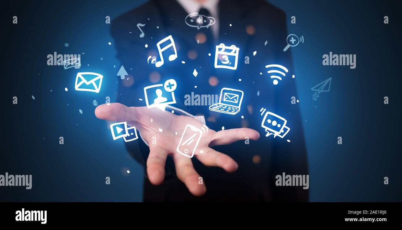 Hand holding application icons and symbols in her hand Stock Photo - Alamy
