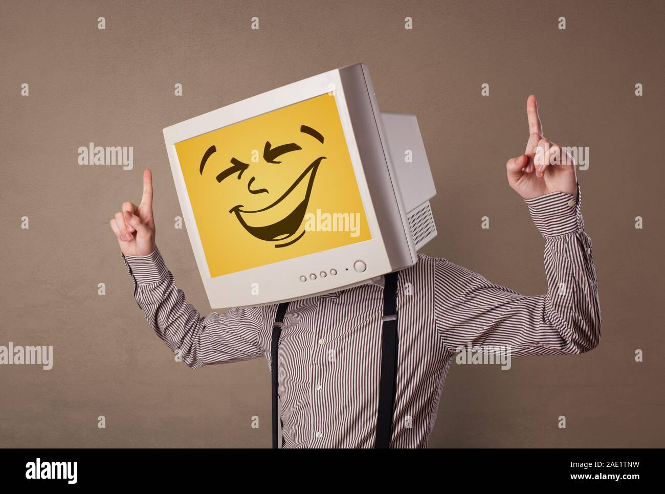 Young person with happy smiley monitor head Stock Photo - Alamy