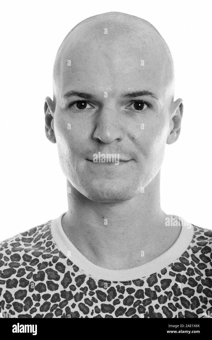 Studio shot of face of young handsome bald man Stock Photo - Alamy