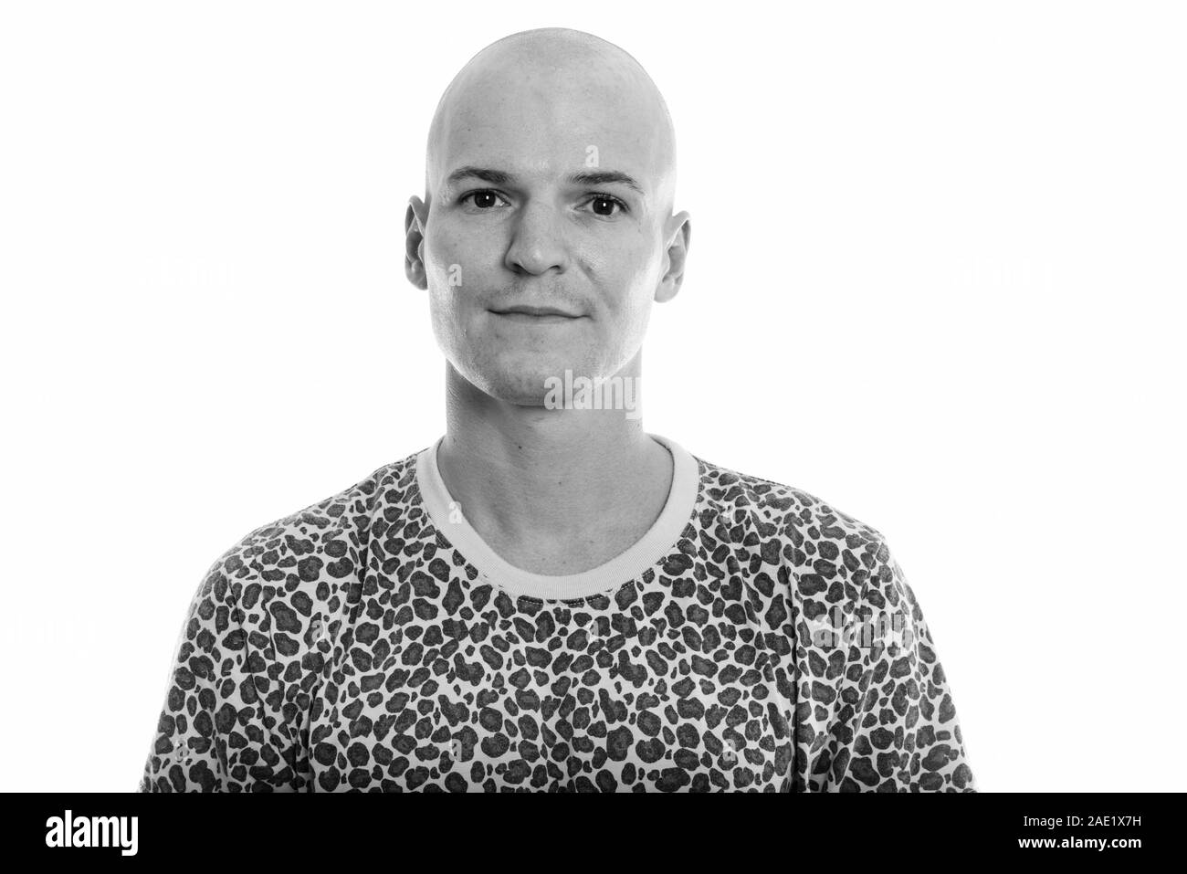 Studio shot of young handsome bald man Stock Photo - Alamy