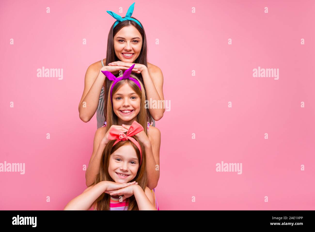 Close up photo of cute lades with headbands standing in stack isolated ...