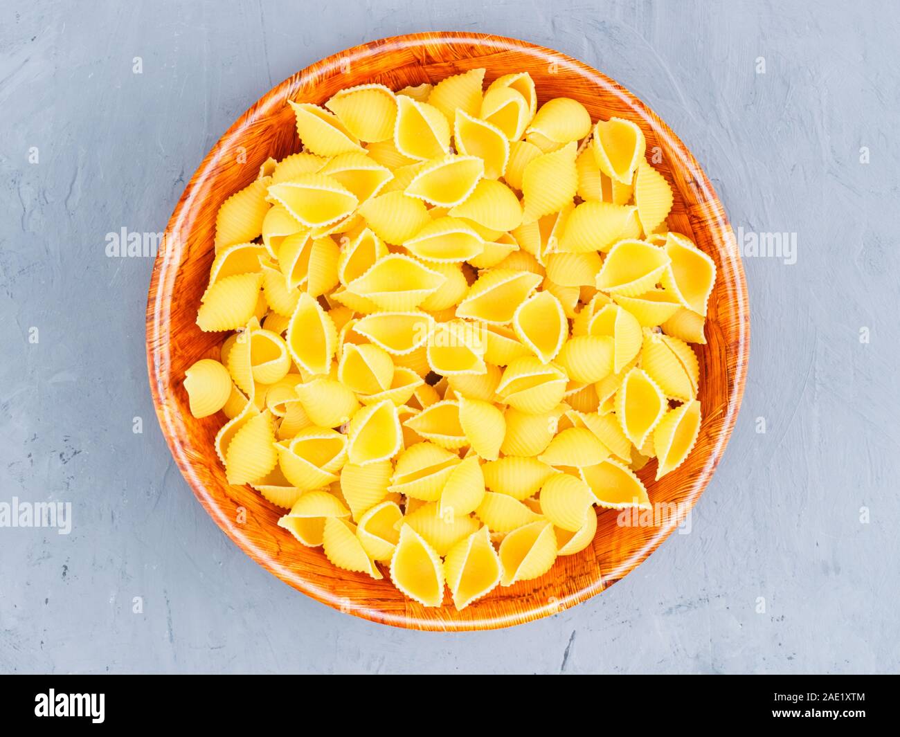 Pasta in bamboo bowl on a gray concrete background. Healthy eating ...