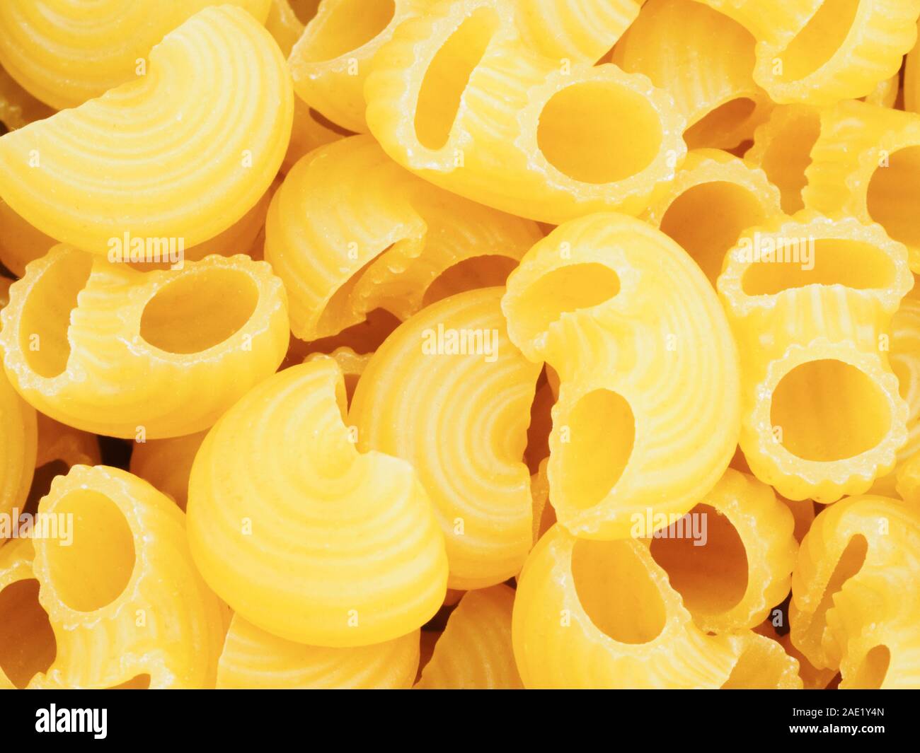Background from pasta type helices. Healthy eating concept Stock Photo ...