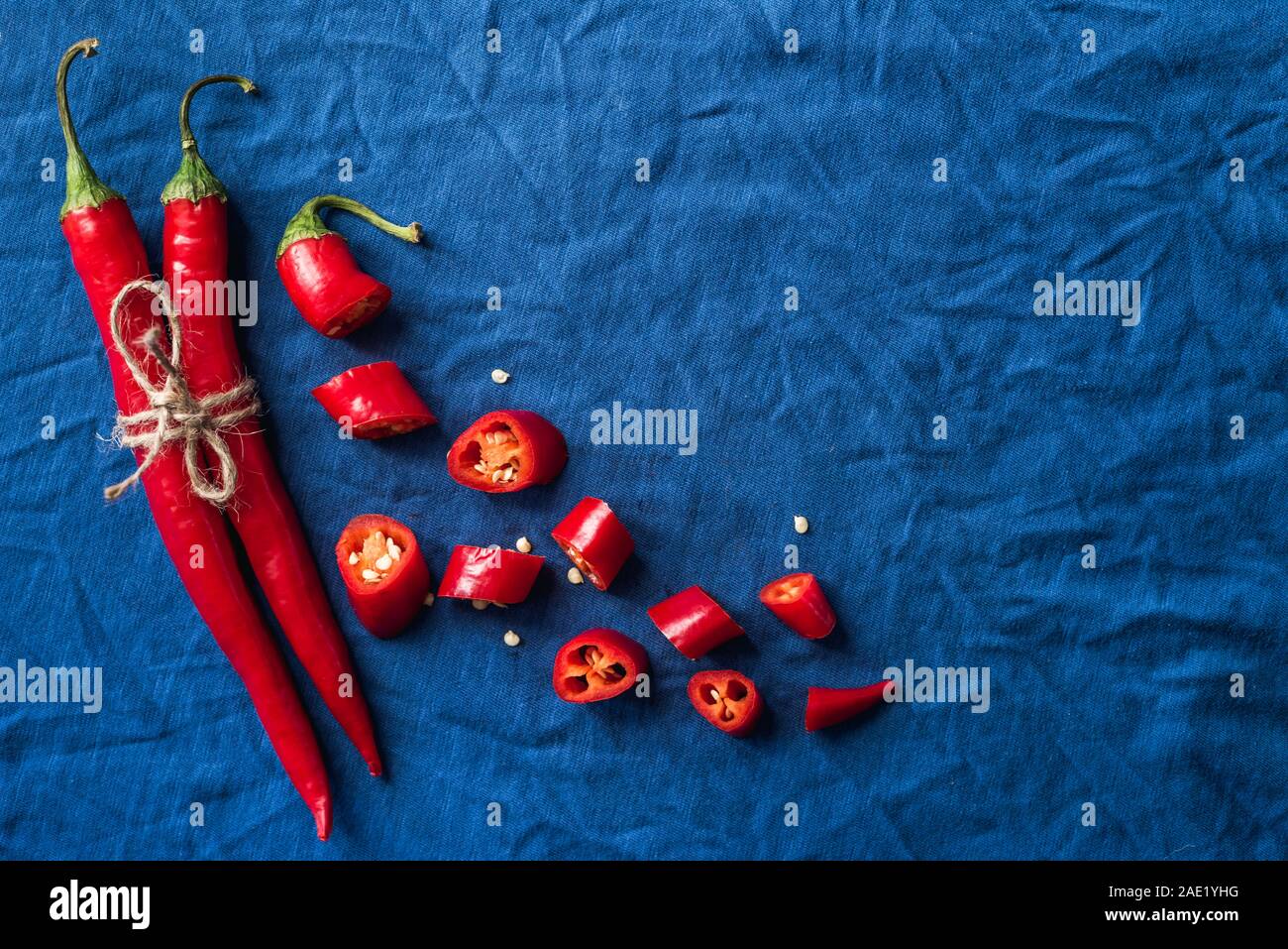 Red chili peppers close-up on classic blue background copy space Stock ...