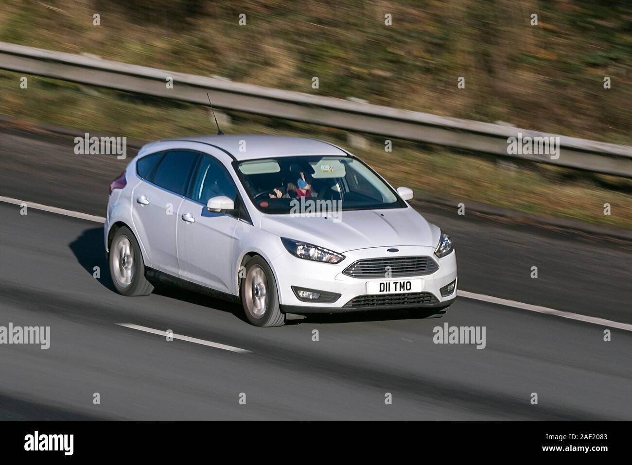 2005 Ford Focus Zetec; Blurred moving car traveling at speed on the M61 ...