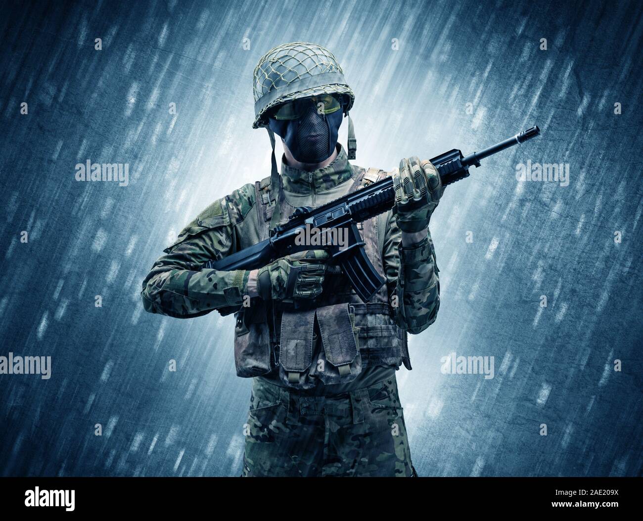 Armed soldier standing in rainy weather Stock Photo - Alamy