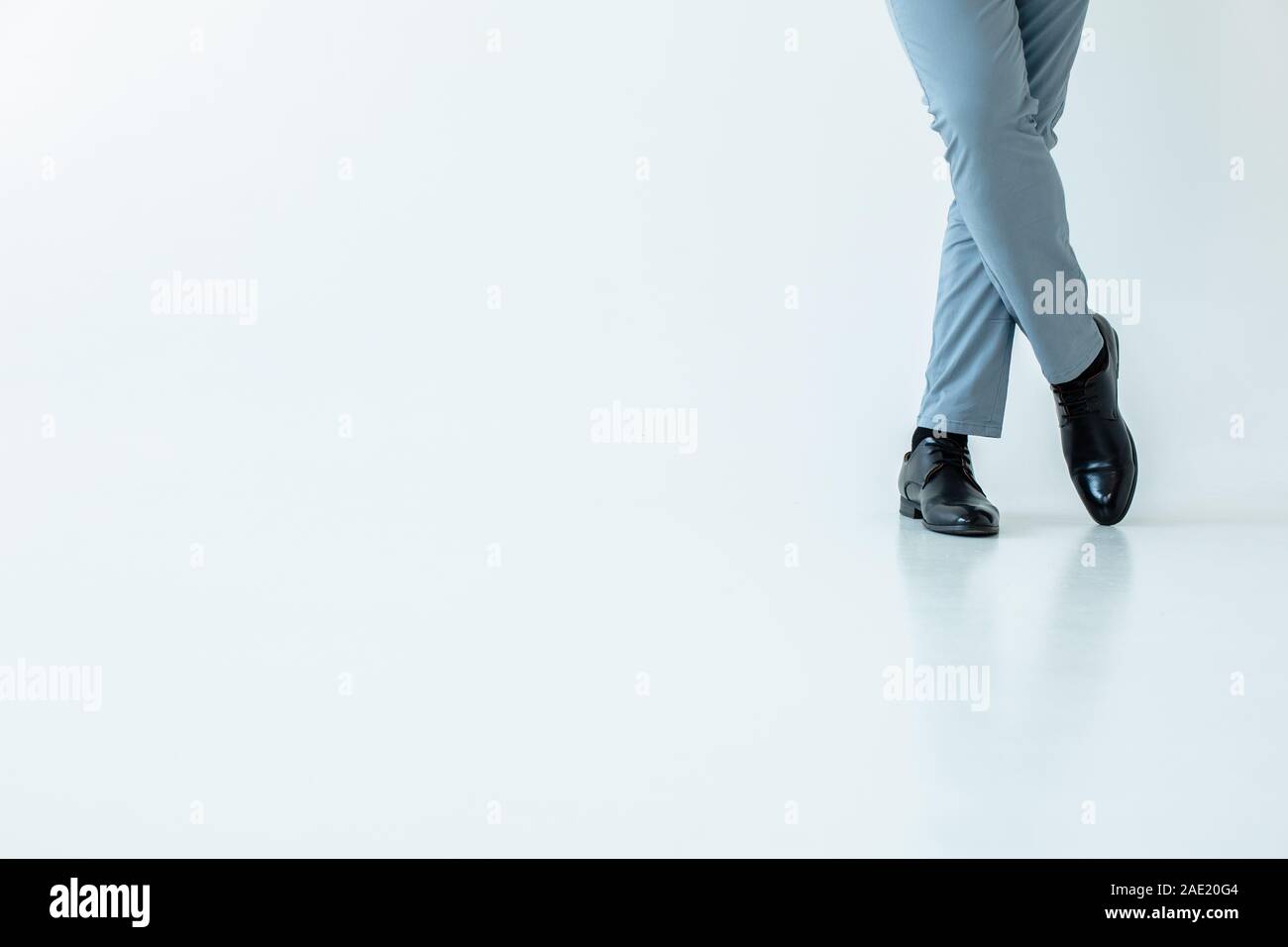 Low angle of successful businessman crossing his legs Stock Photo - Alamy