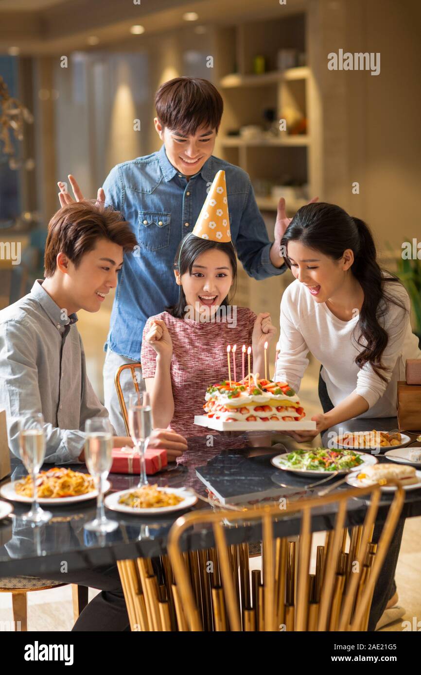 Young friends having birthday party at home Stock Photo - Alamy