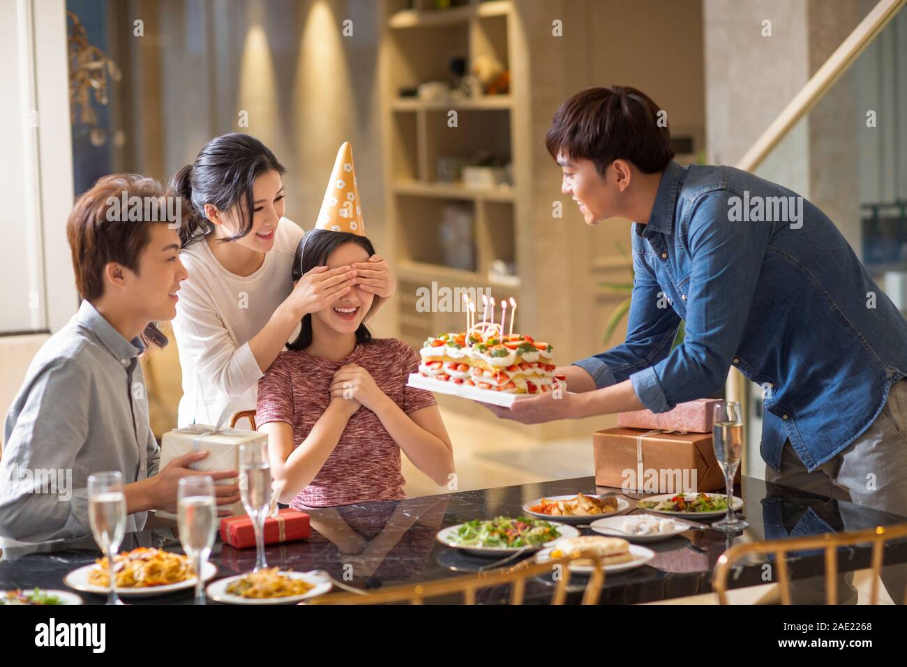 Young friends having birthday party at home Stock Photo - Alamy