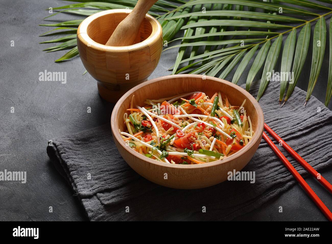 Delicious Som Tam -Thai green papaya salad) with green beans, tomatoes ...