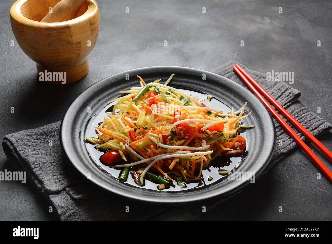 Delicious Som Tam -Thai green papaya salad) with green beans, tomatoes ...