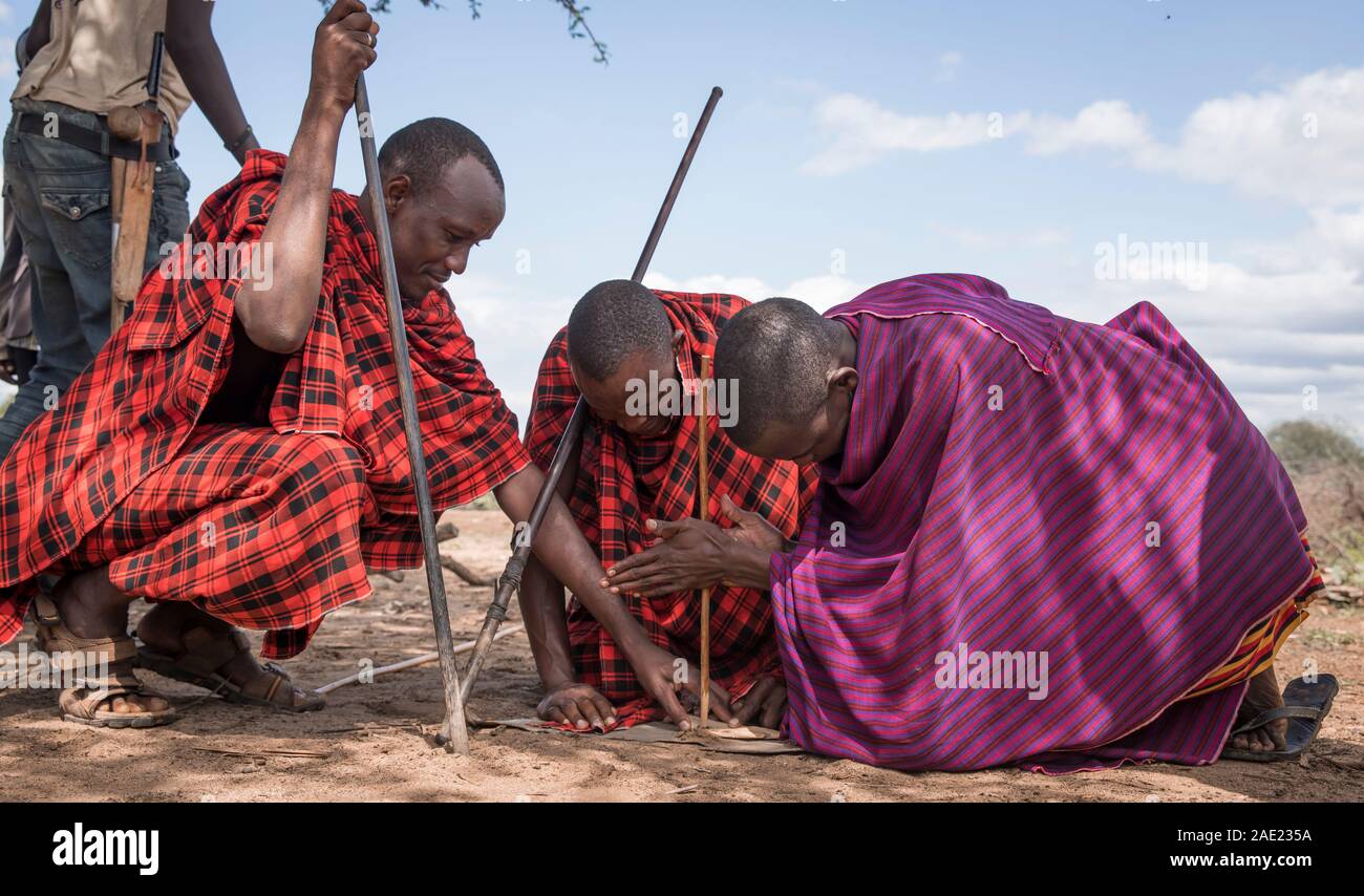 Same, Tanzania, 6th June, 2019: Maasai men making fire Stock Photo - Alamy