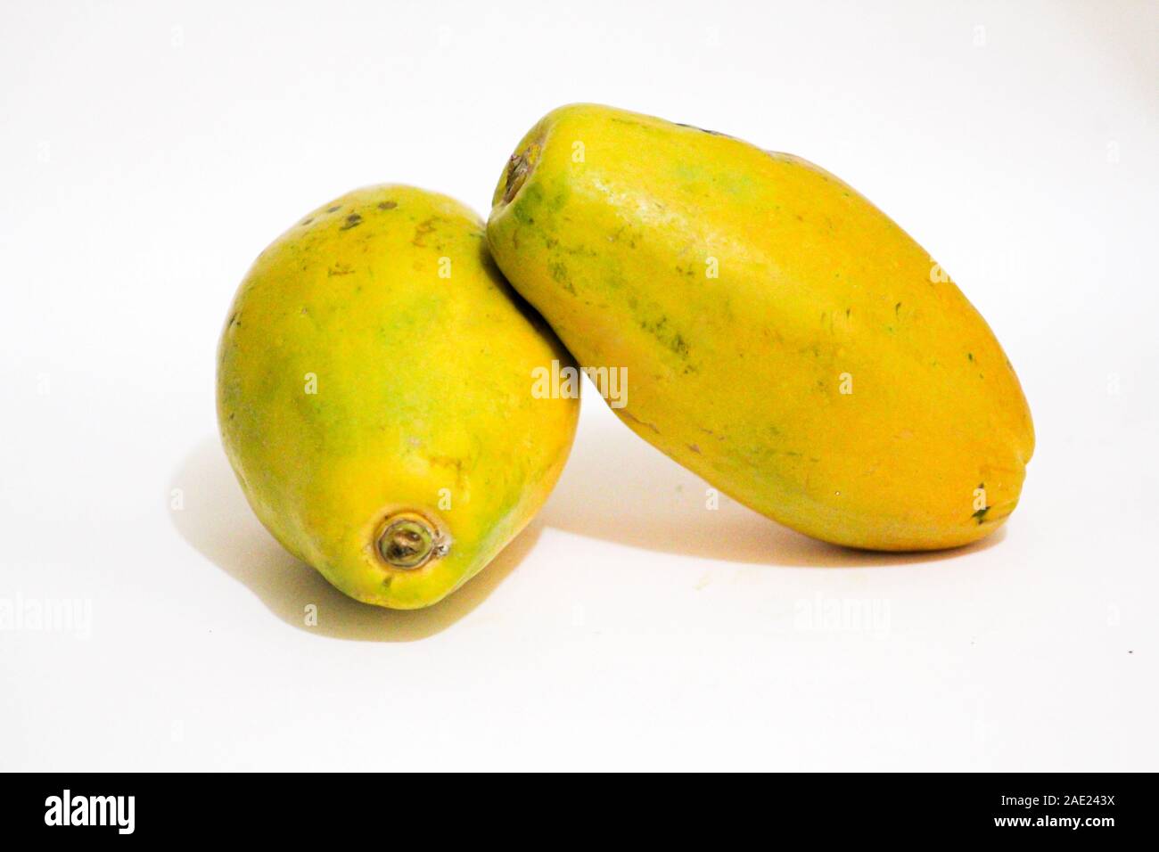 Two ripe papaya isolated on a white background Stock Photo - Alamy