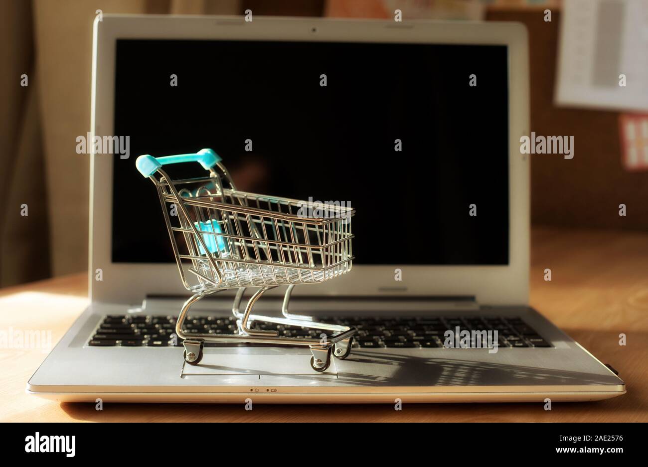 Shopping cart on laptop computer keyboard. Online shopping concept ...