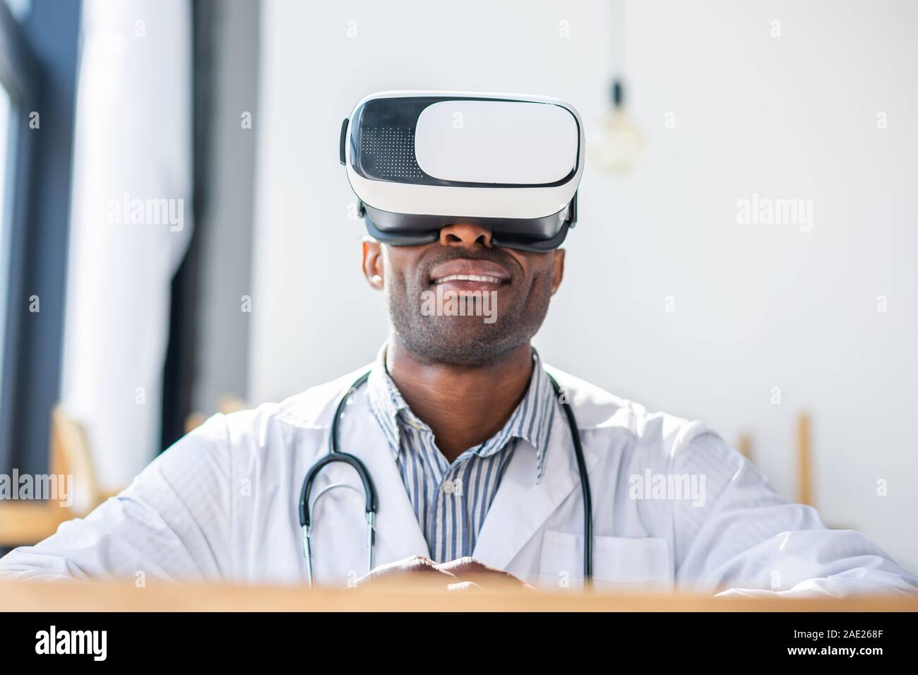 Low angle photo of pleased man that keeping smile on face Stock Photo ...