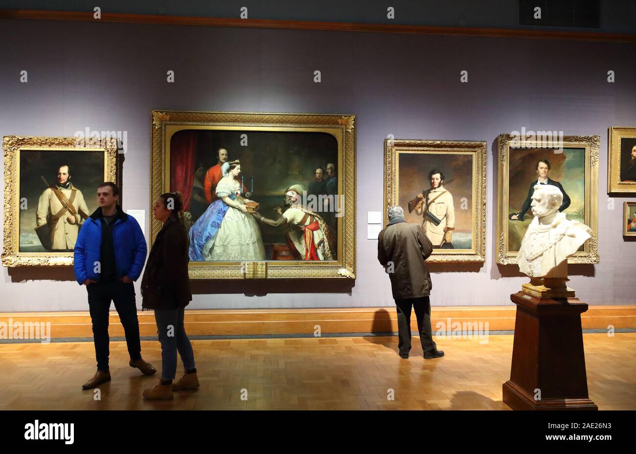 Visitors studying Victorian portraits at the National Portrait Gallery ...