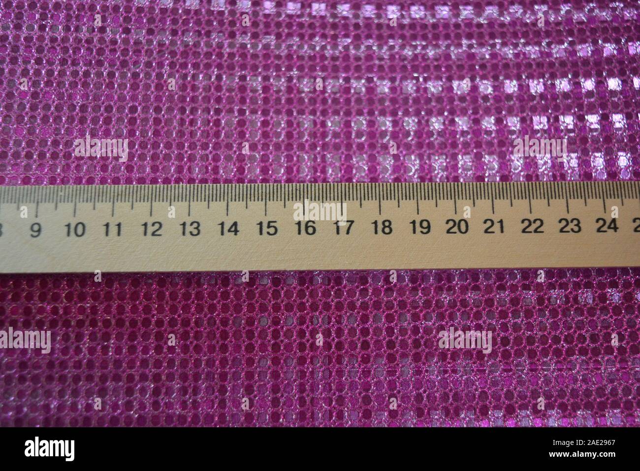 Light wooden mathematical ruler on a pink reflective background Stock ...