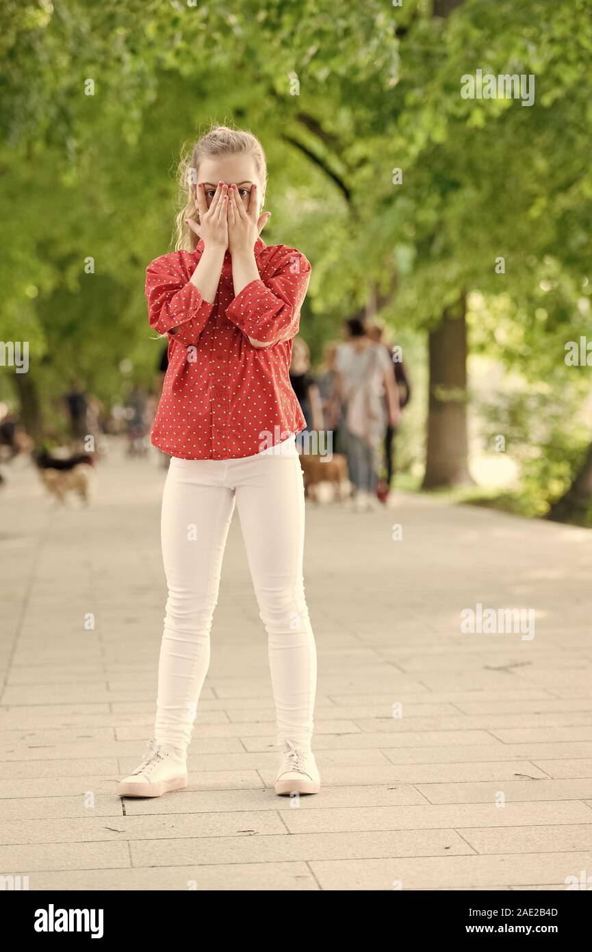 Happy hiding game outdoors. Hide and seek urban background. Happy ...