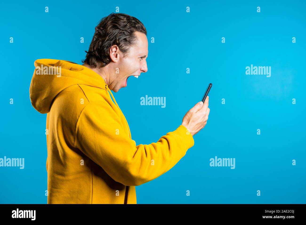 Man on phone swears black hi-res stock photography and images - Alamy