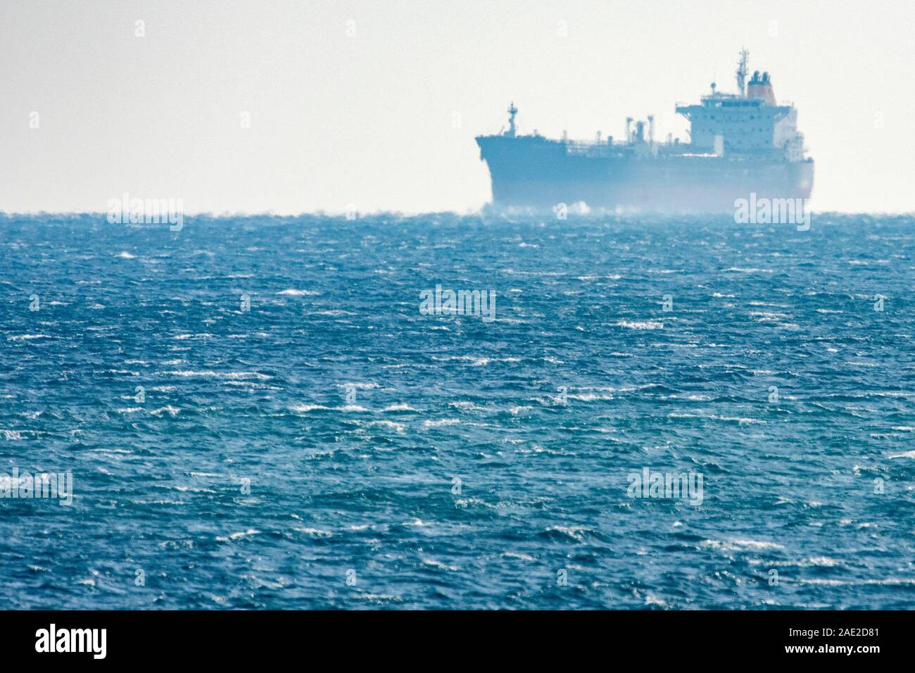 Big ship mirage on sea horizon line landscape Stock Photo - Alamy