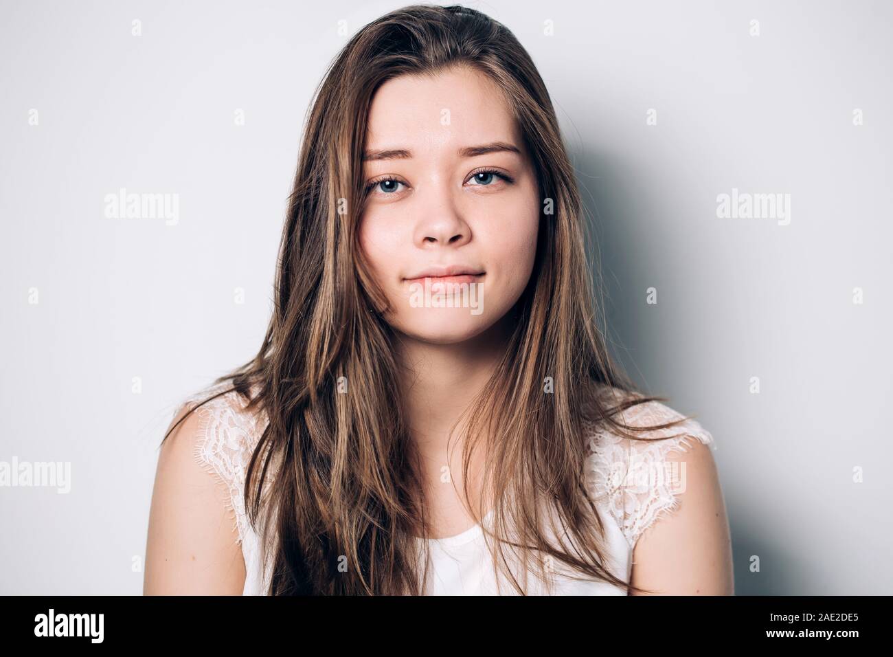 Beautiful smiling woman with clean skin, natural make-up, Watching with ...