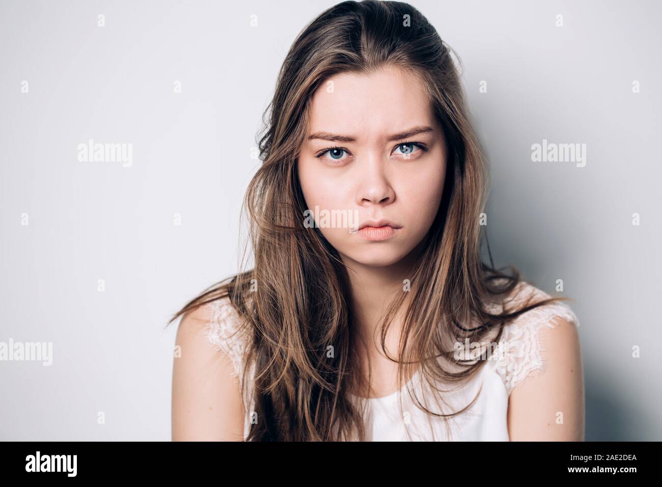 Close up isolated portrait of young annoyed angry woman. Young female ...