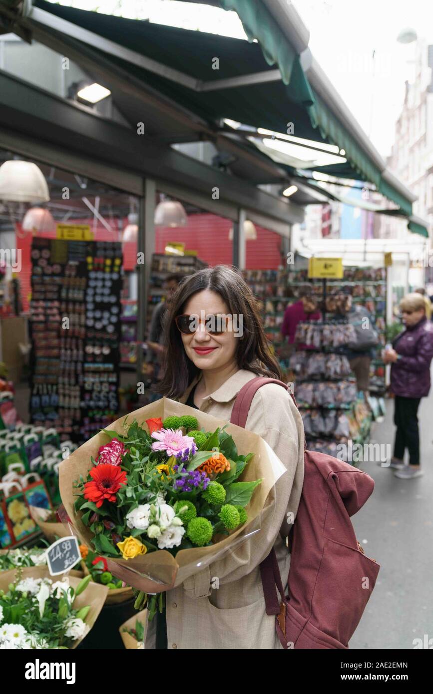 Holding flowers flower hi-res stock photography and images - Alamy