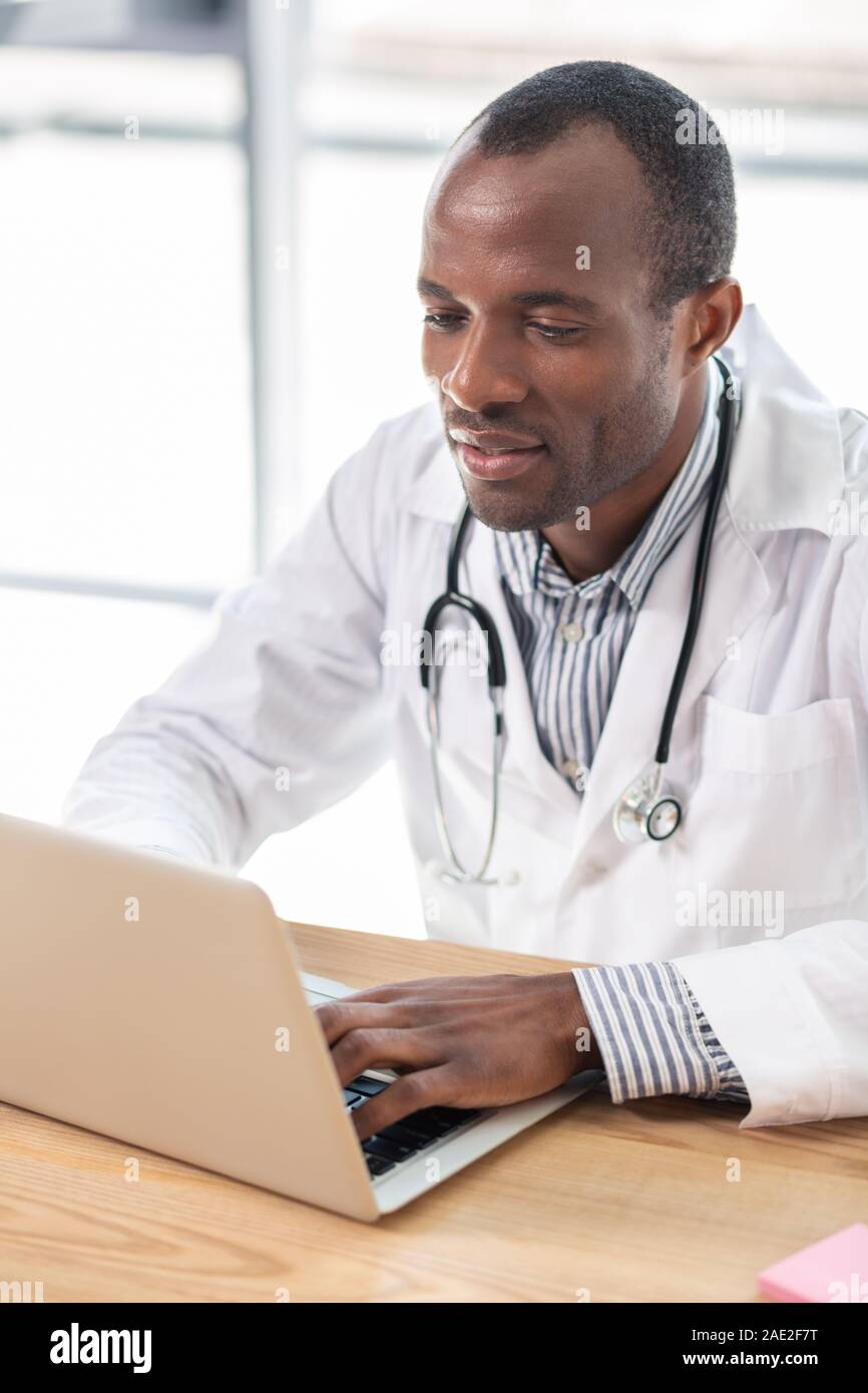 Concentrated international man typing hi-res stock photography and ...