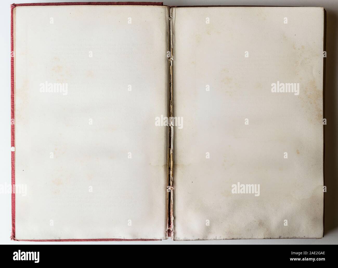 Antique book unfolded showing textured pages isolated on black ...