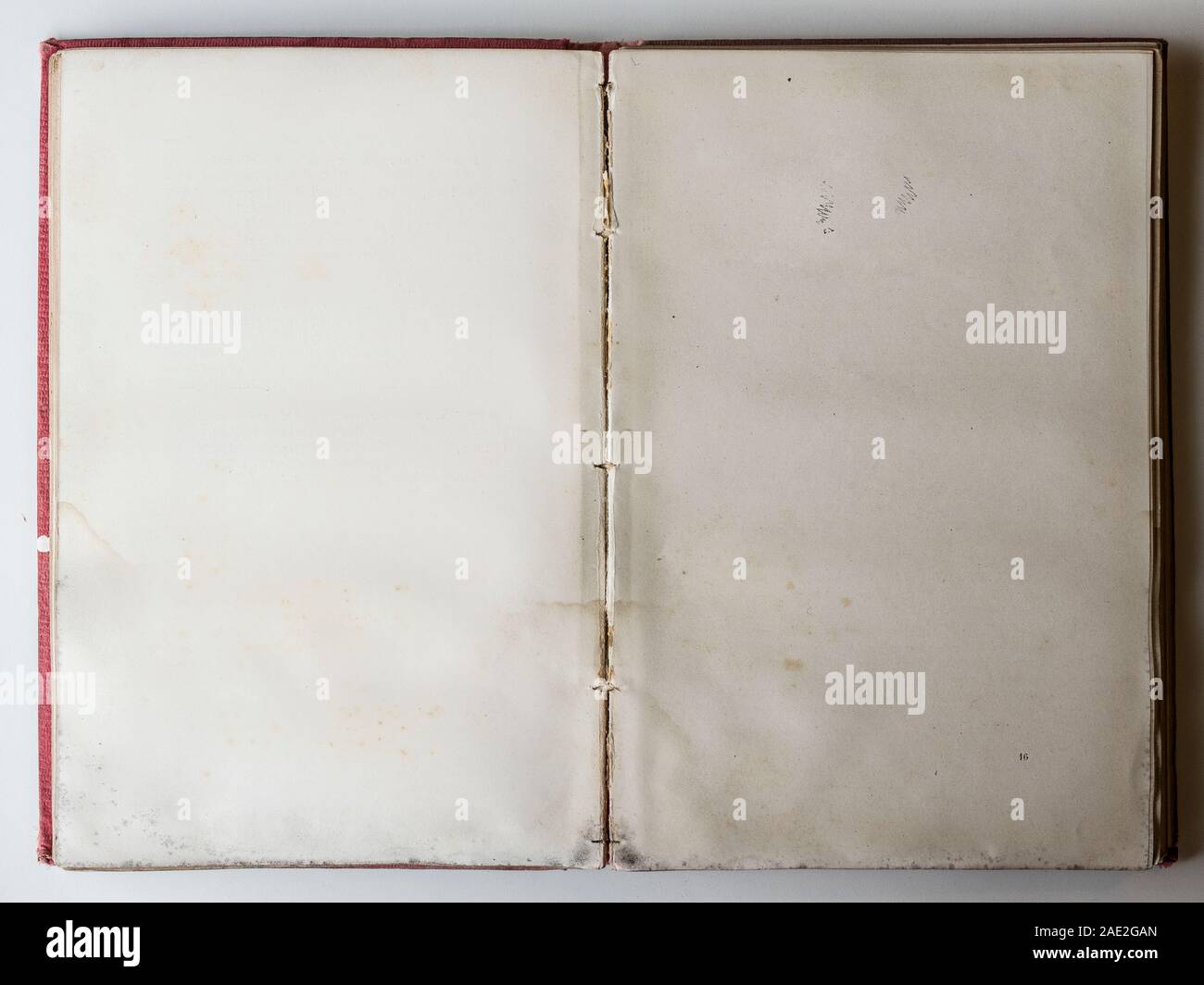 Antique book unfolded showing textured pages isolated on black ...