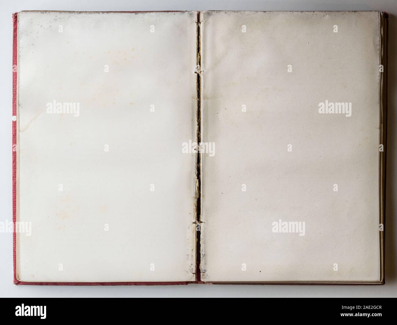 Antique book unfolded showing textured pages isolated on black ...