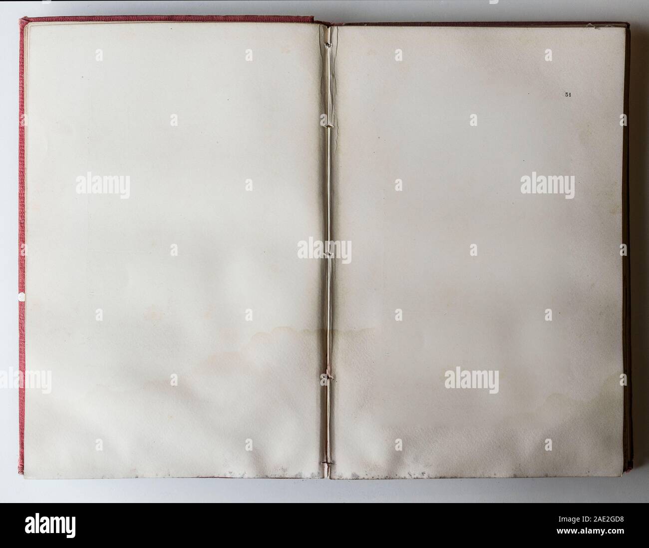 Antique book unfolded showing textured pages isolated on black ...