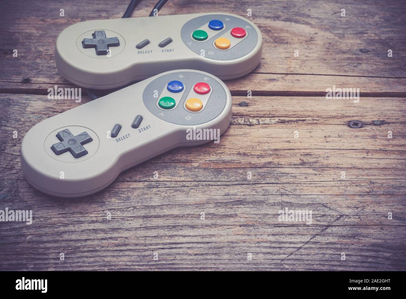 Retro computer gaming controller a rustic wooden background Stock Photo ...