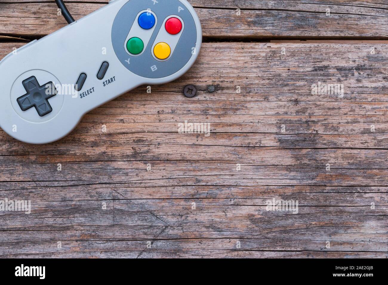 Retro computer gaming controller a rustic wooden background Stock Photo ...