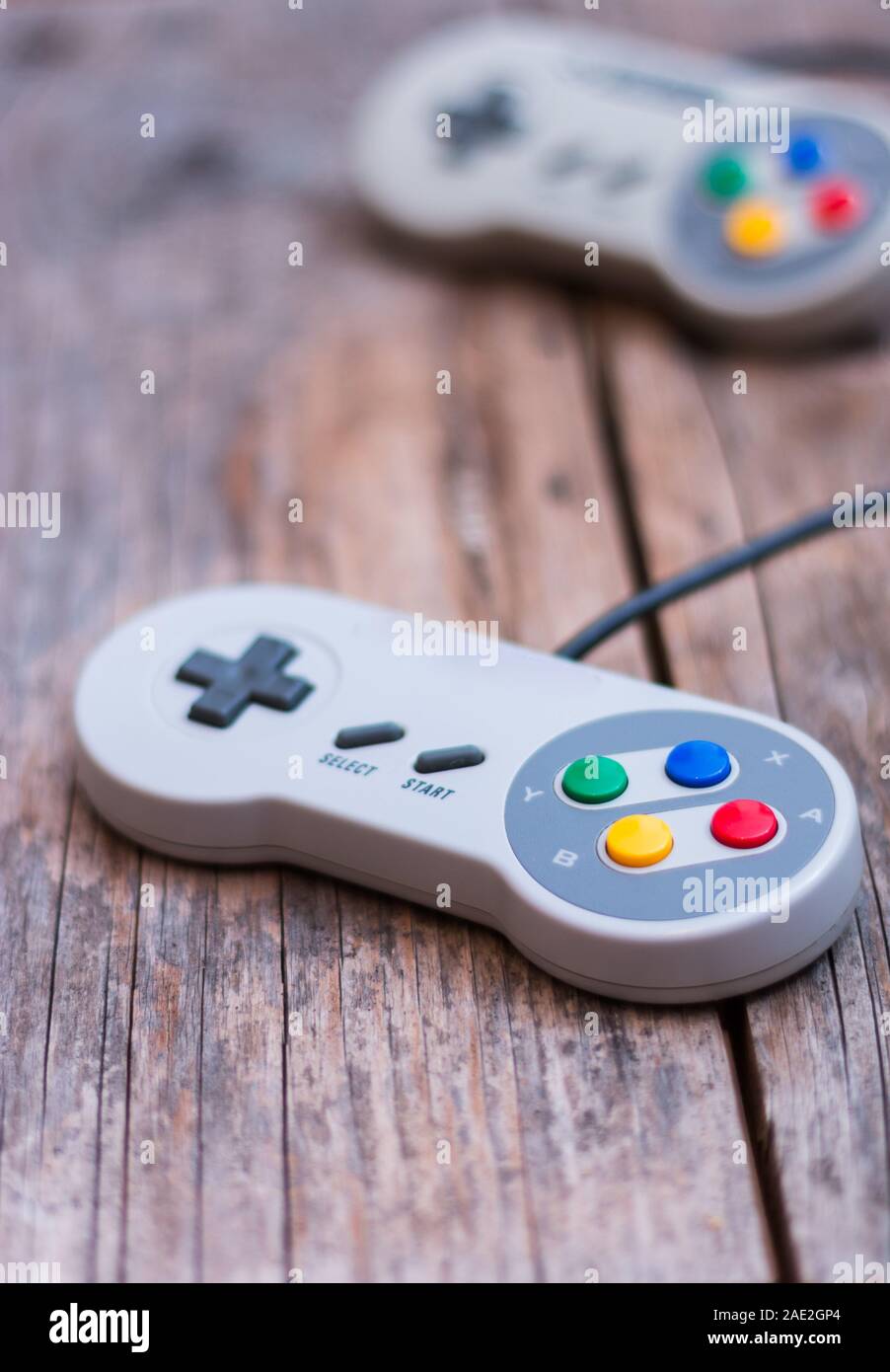 Retro computer gaming controller a rustic wooden background Stock Photo ...
