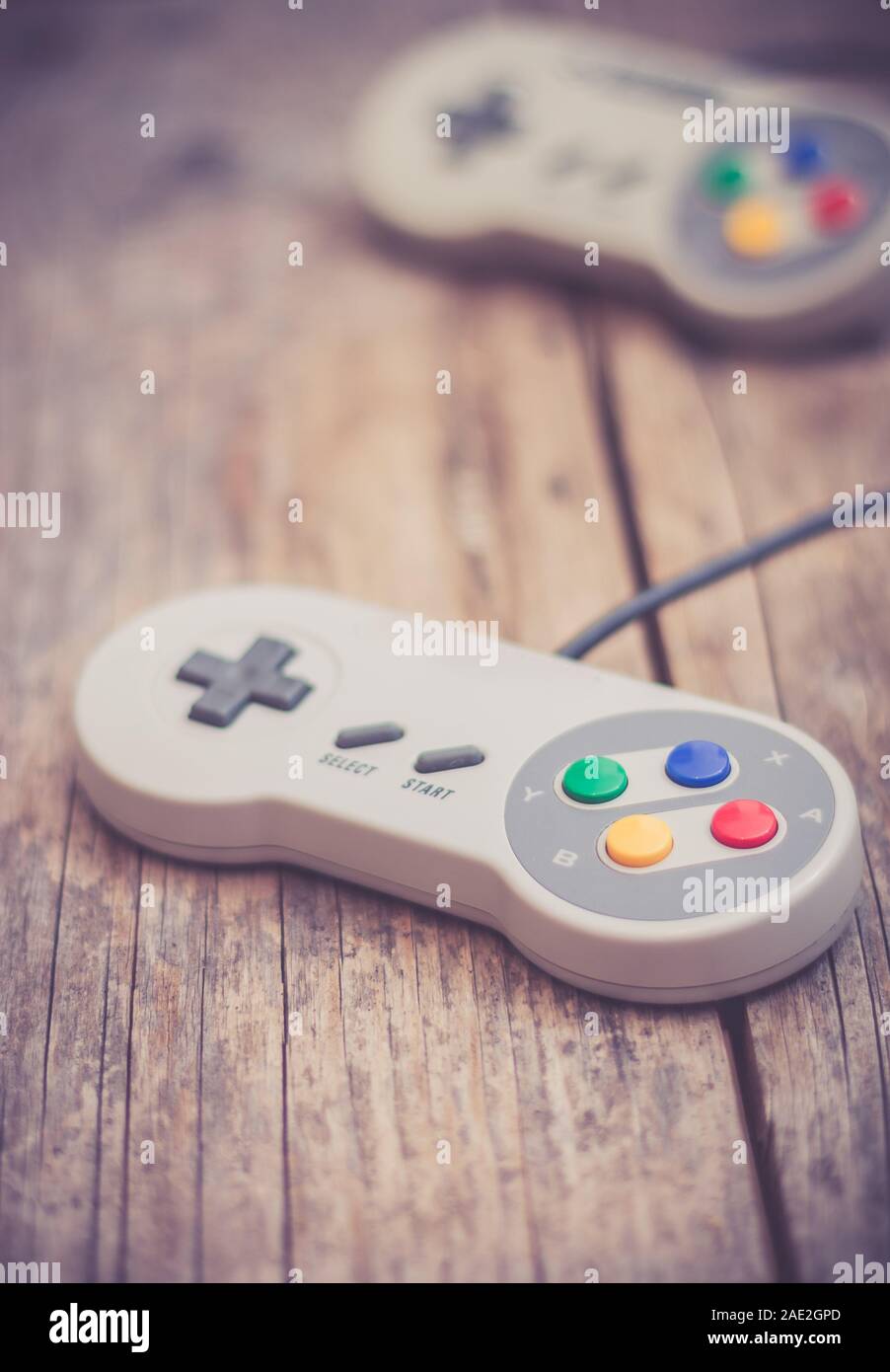Retro computer gaming controller a rustic wooden background Stock Photo ...